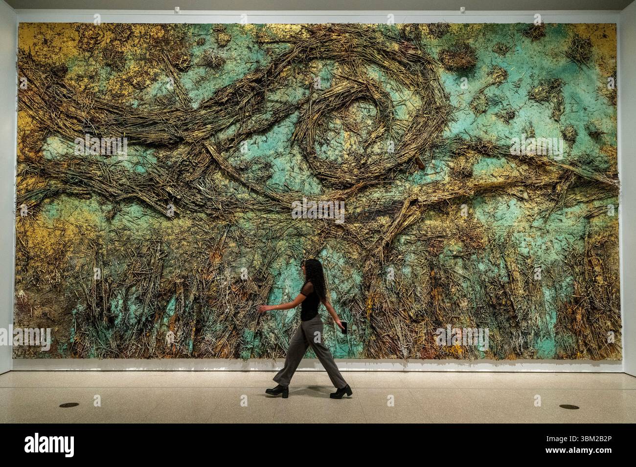 London, UK. 24 June 2025. A staff member passes ‘The Starry Night ...