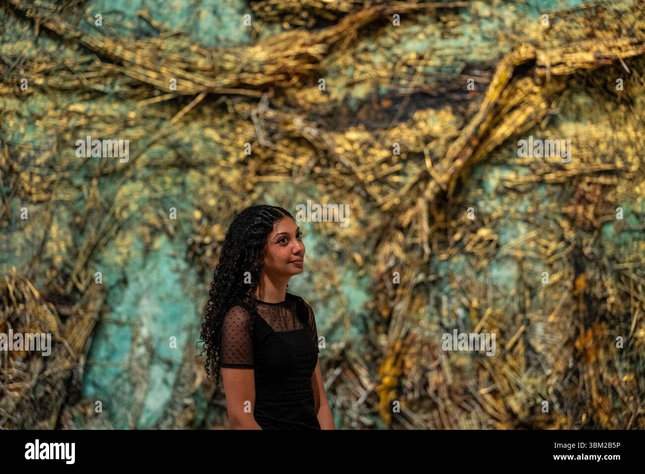 London, UK. 24 June 2025. A staff member with ‘The Starry Night’, 2019 ...