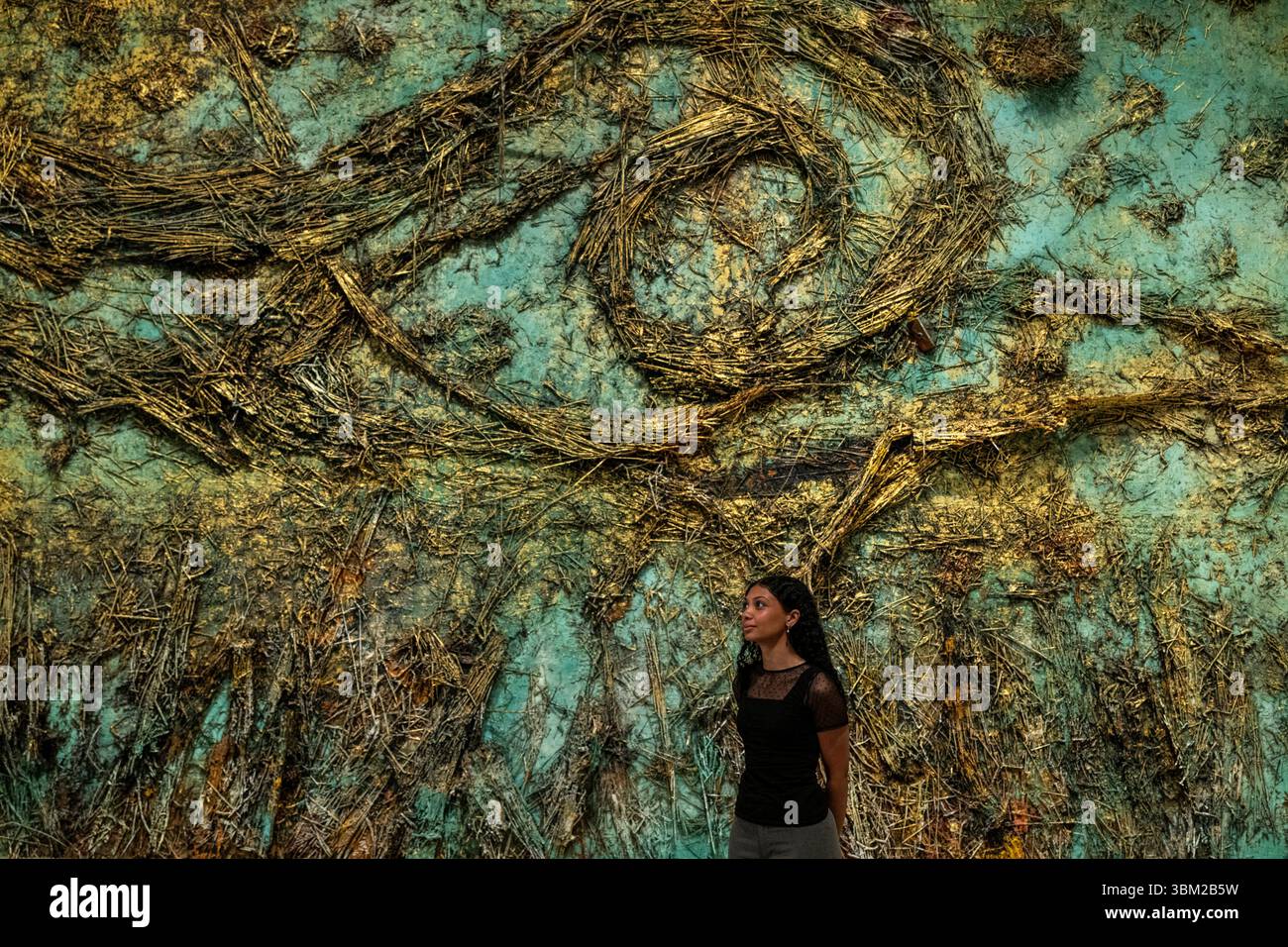 London, UK. 24 June 2025. A staff member with ‘The Starry Night’, 2019 ...
