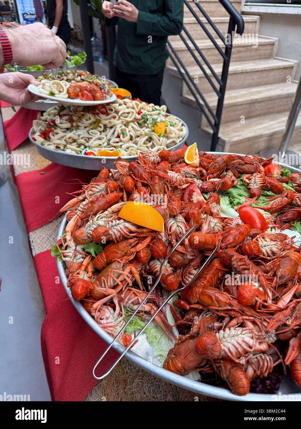Outdoor seafood serving at all-inclusive hotel. Bright bowl of red ...