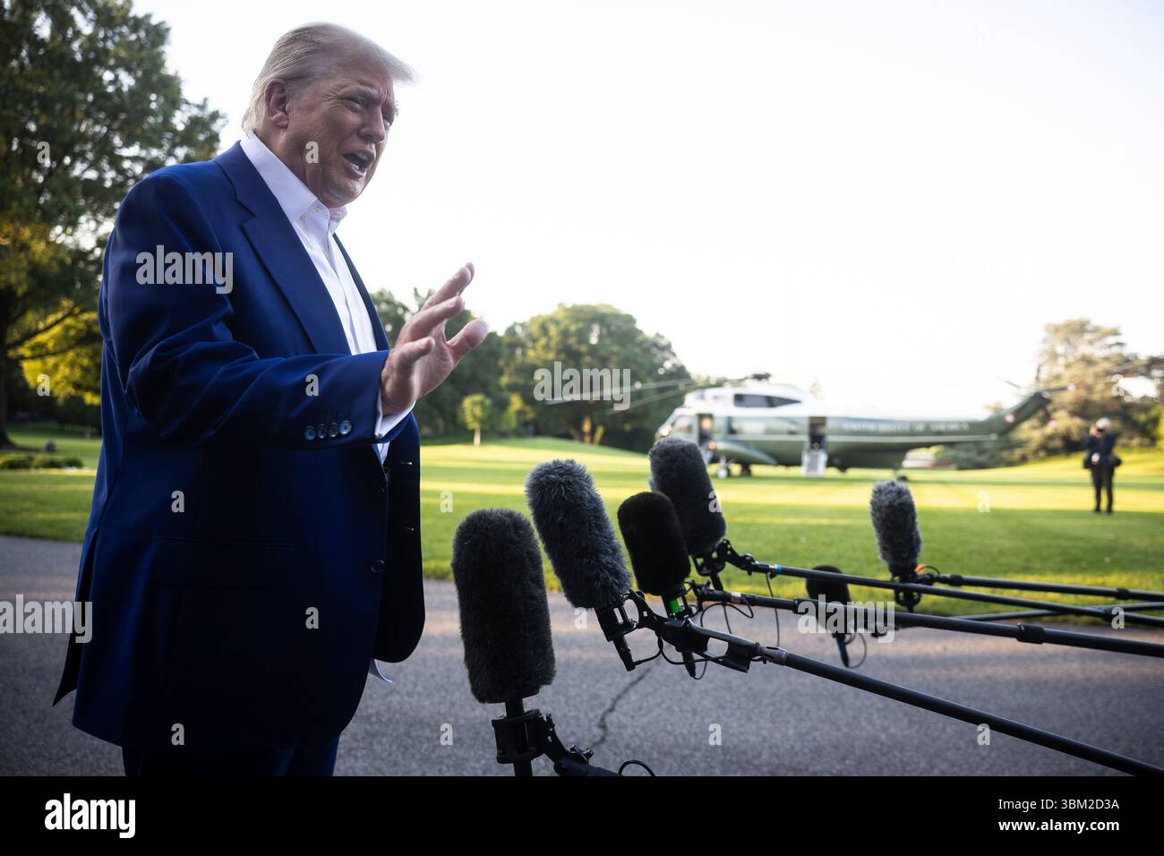 President Donald Trump speaks with reporters on the South Lawn of the ...