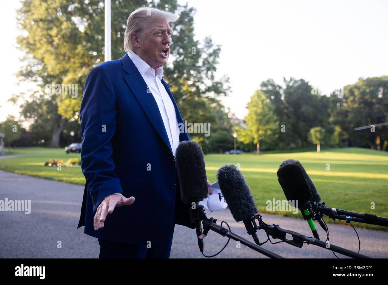 President Donald Trump speaks with reporters on the South Lawn of the ...