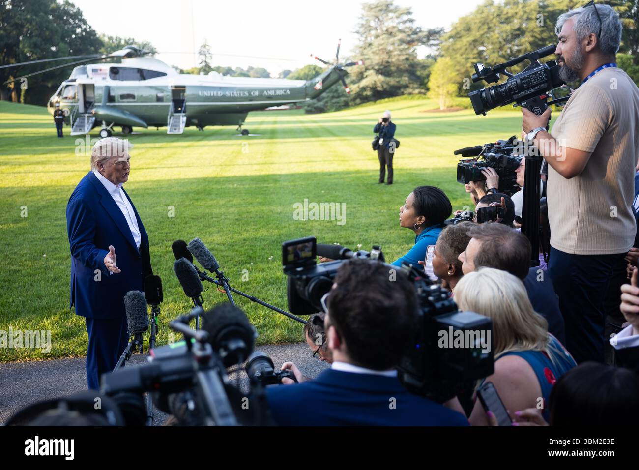 President Donald Trump speaks with reporters on the South Lawn of the ...