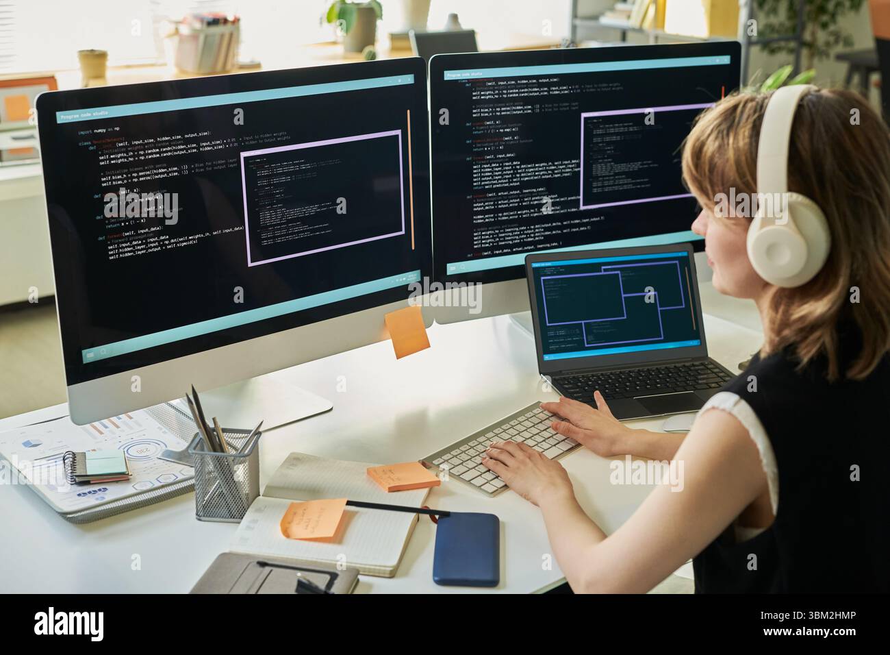 Woman Developing Neural Network Code on Multiple Computer Screens Stock ...