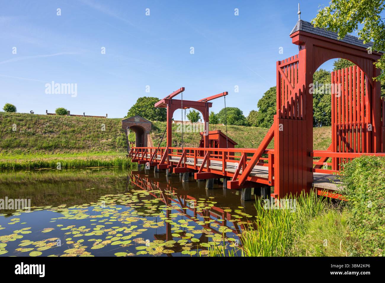 Red bridge over a moat in Bourtange, the Netherlands Stock Photo - Alamy