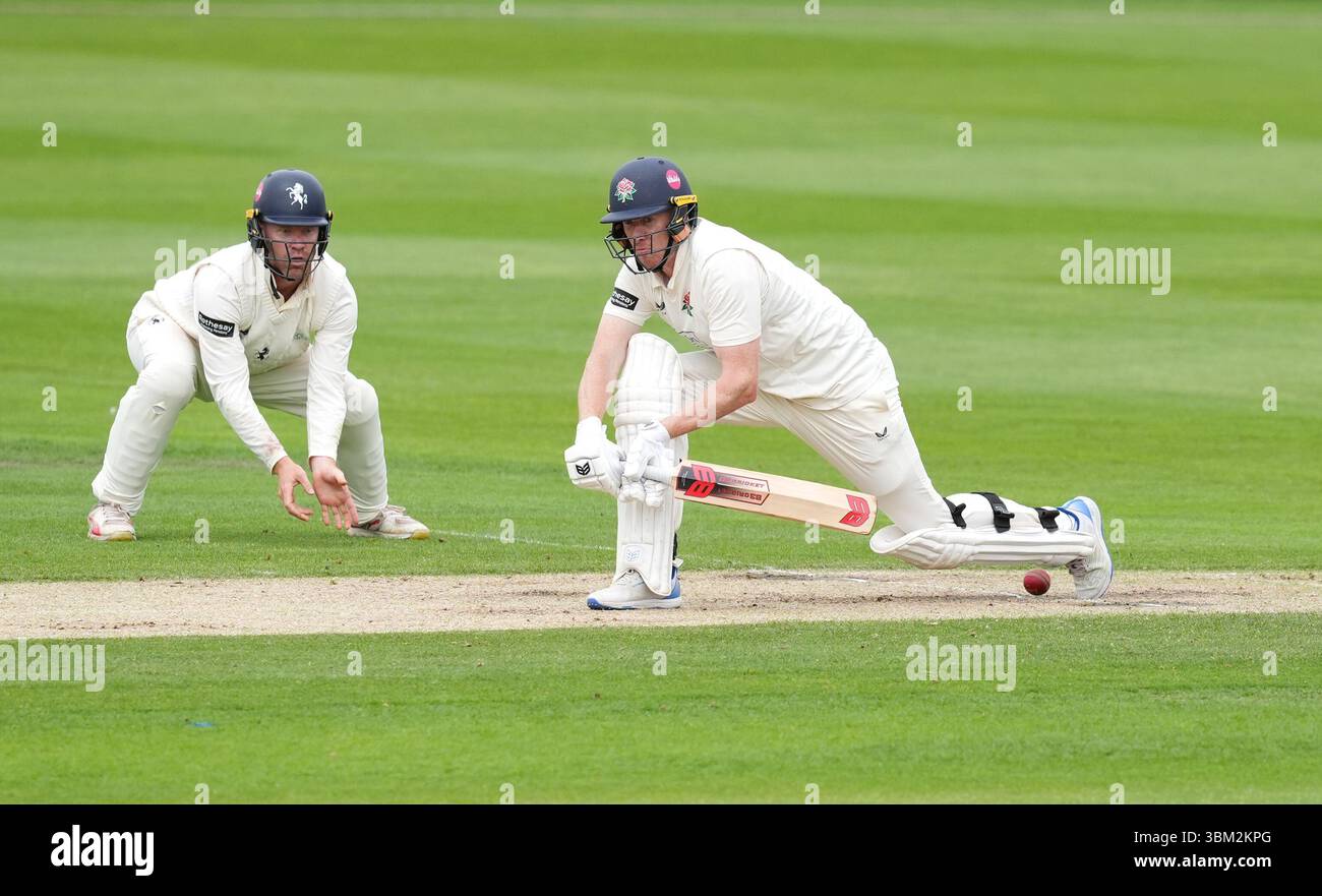 Lancashire's Luke Wells hits out against Kent from the bowling of Matt ...