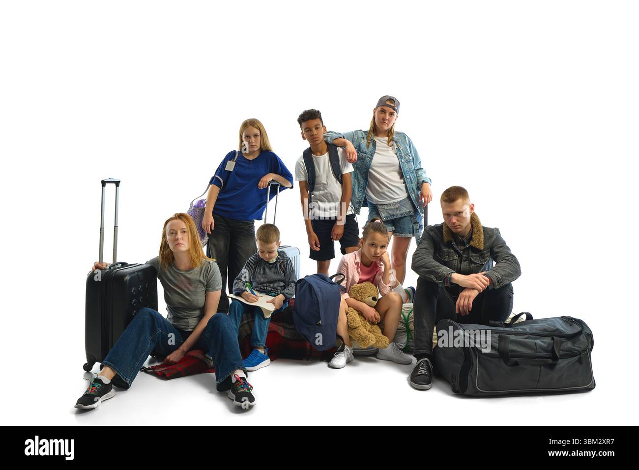 Multigenerational family with baggage expressing uncertainty of ...