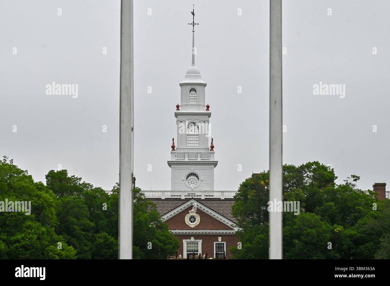 The Delaware Legislative Hall seen through flagpoles at the Delaware ...