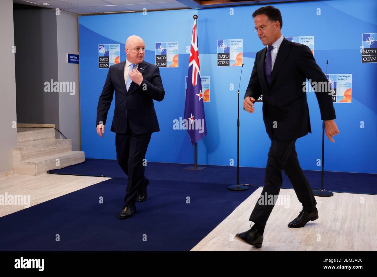 NATO Secretary General Mark Rutte, right, walks with New Zealand's ...