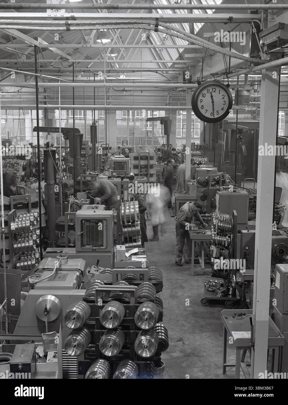 1950s, historical, engineering factory, workers at lathes producing ...