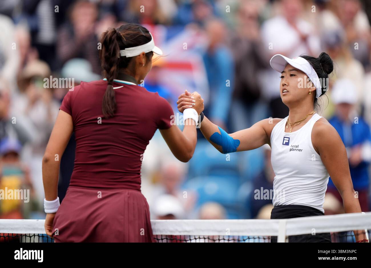 Emma Raducanu and Ann Li shake hands after their match during day two ...