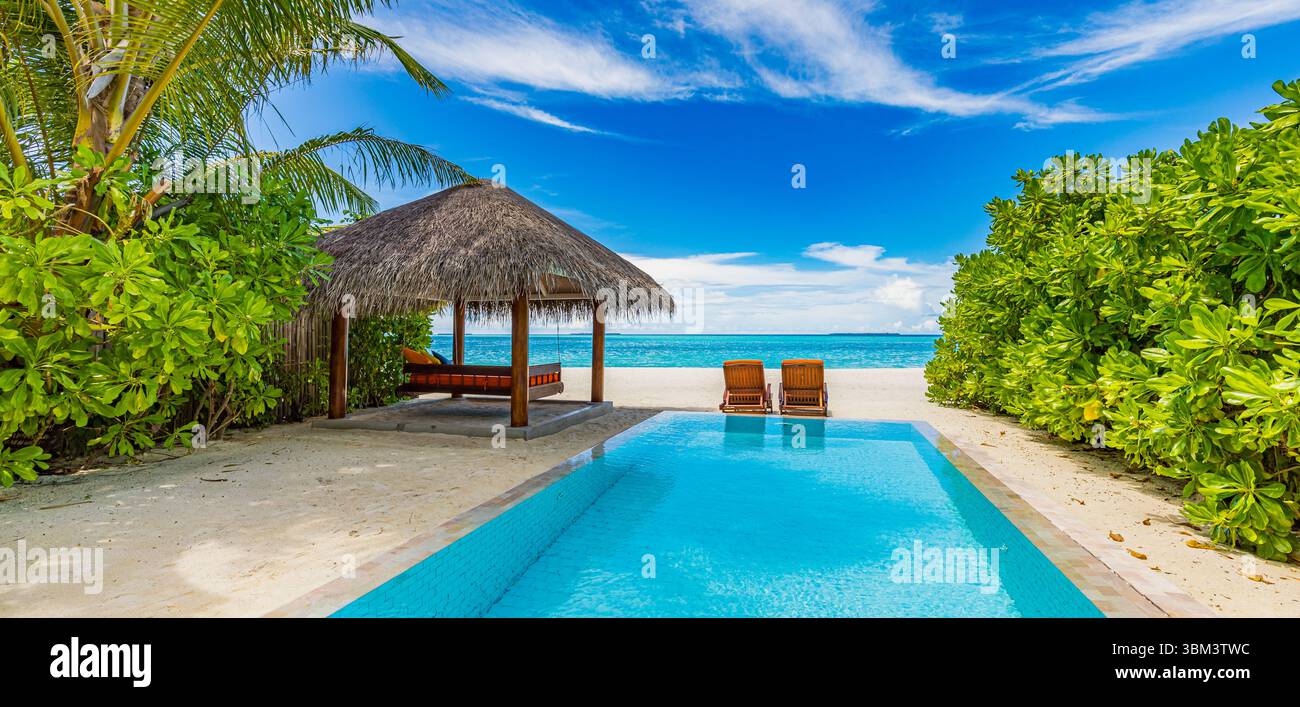 Stunning summer infinity pool with lounge chairs sea view tropical ...