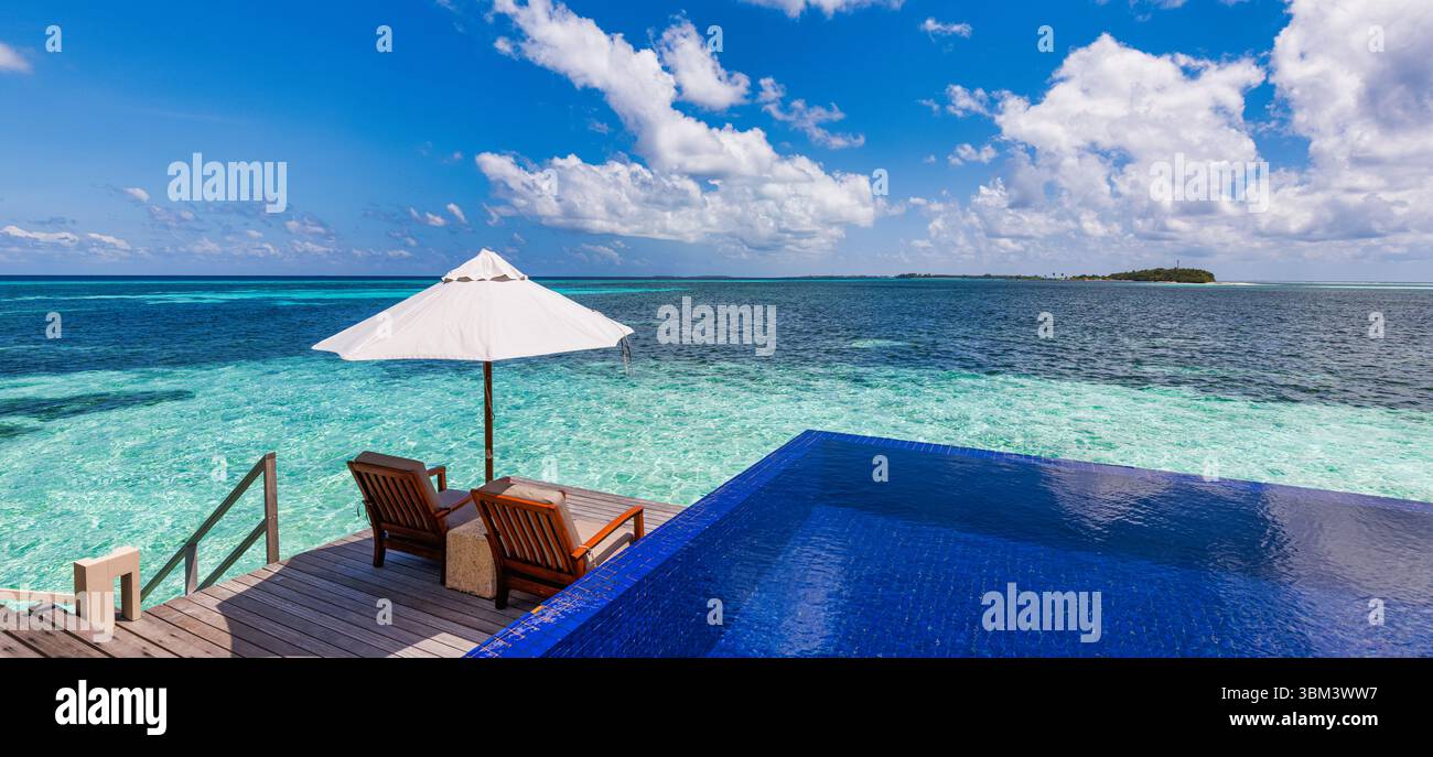 Stunning luxury resort infinity pool with chairs umbrella, breathtaking ...