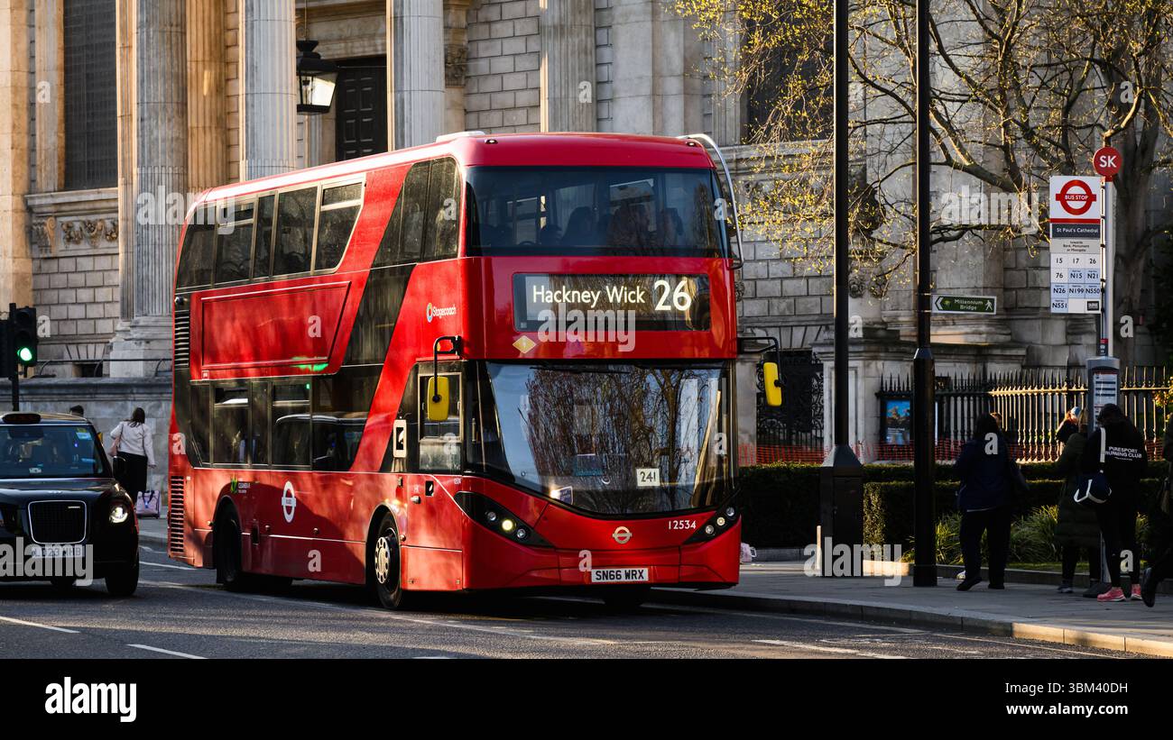 London, UK - April 1, 2025; Red London double decker bus iin City of ...