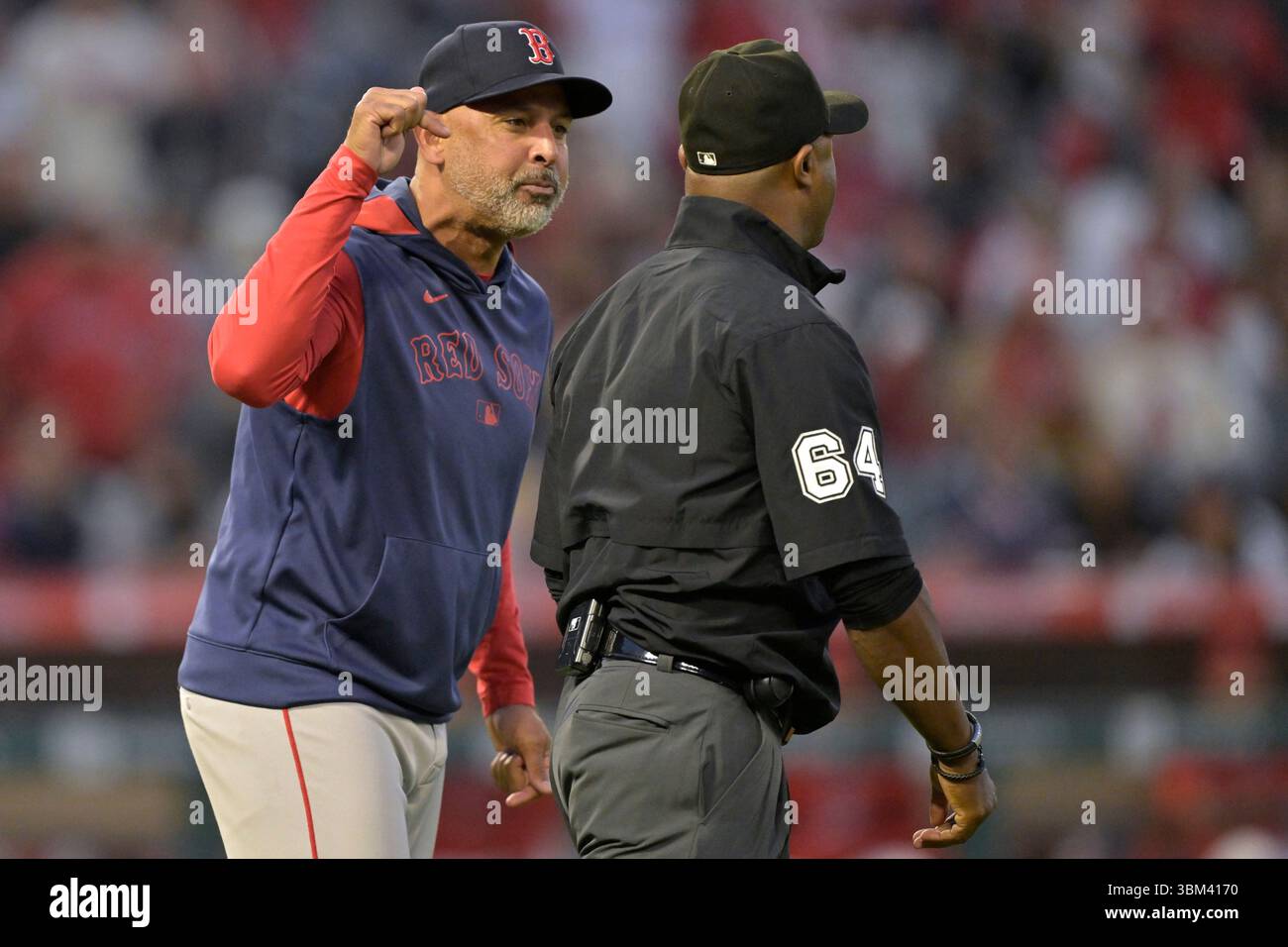 Boston Red Sox manager Alex Cora argues with umpire Alan Porter (64 ...