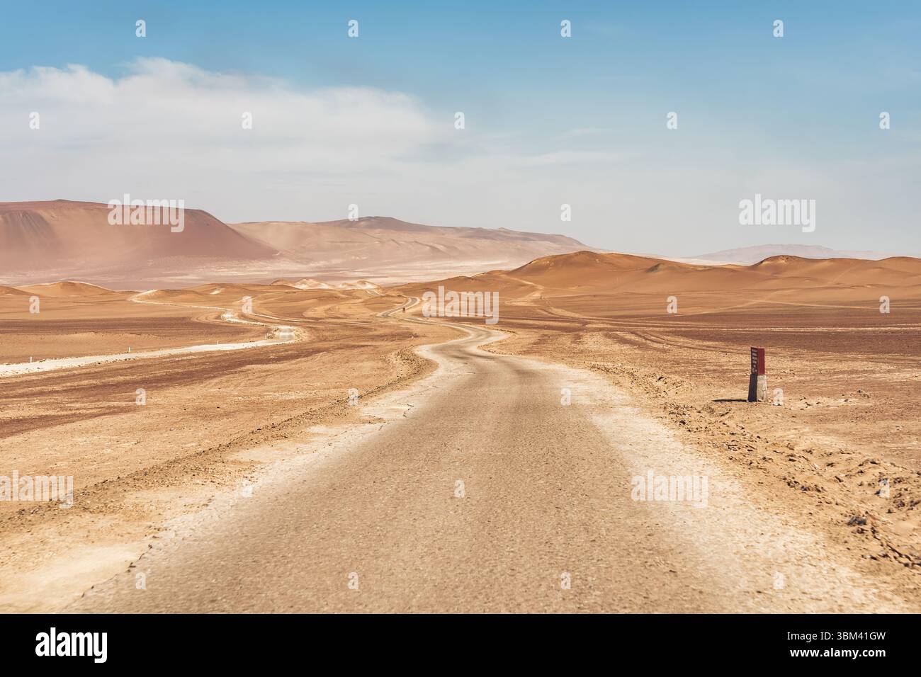 Winding road through the Desert of Paracas National Reserven in Peru ...