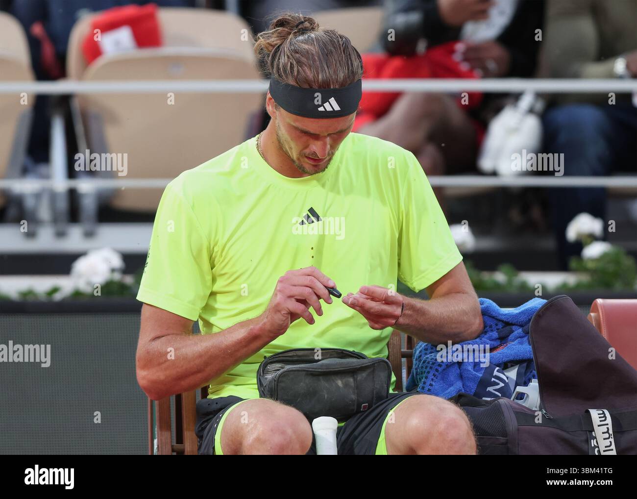 German tennis player Alexander Zverev testing diabetes on glucose meter ...