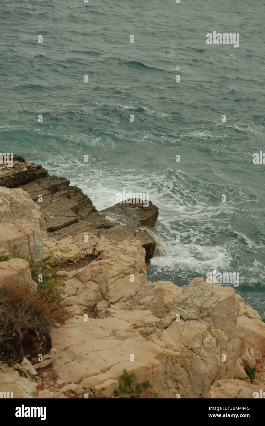 Close-up view of a rugged Adriatic shoreline with dry coastal ...