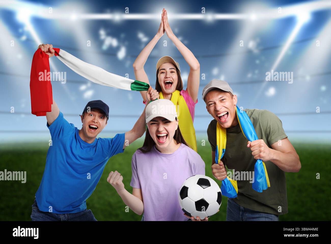 Excited football fans with flags on stadium Stock Photo - Alamy