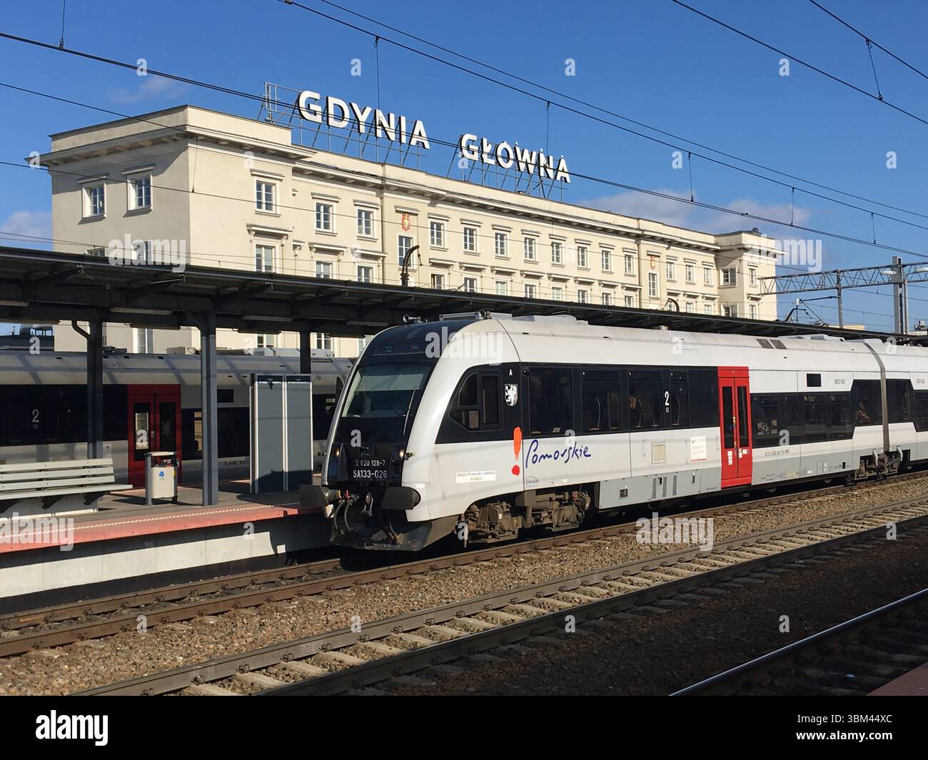A modern PKP Intercity Pendolino and regional Polish trains stand at ...