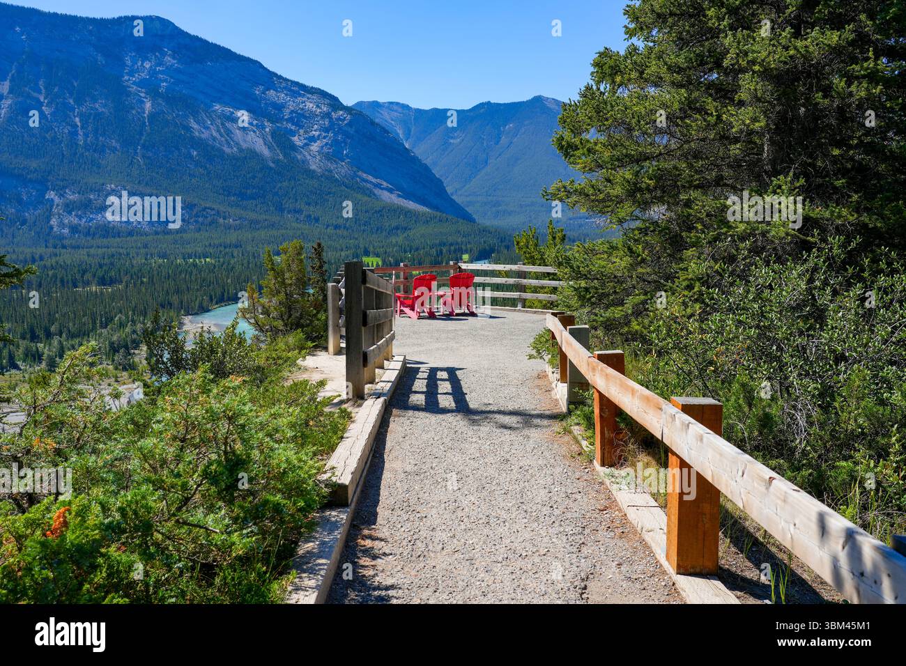 Adirondack red chairs on a viewpoint over the Bow River Valley along ...