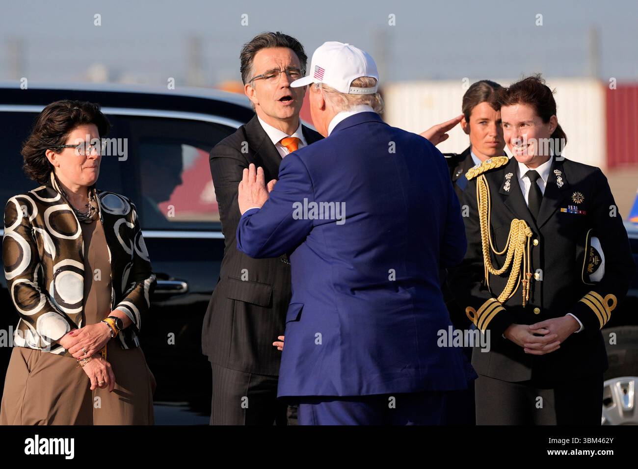 President Donald Trump is greeted as he arrives at Amsterdam Schiphol ...