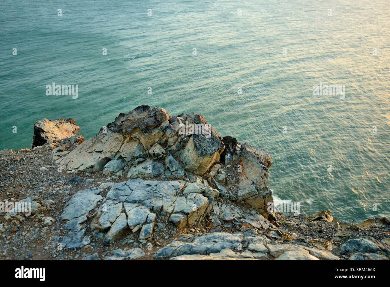 Aerial view of the Caribbean Sea on top of a rocky cliff in the desert ...