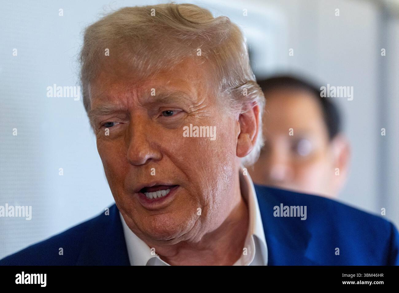 President Donald Trump speaks with reporters on Air Force One while in ...