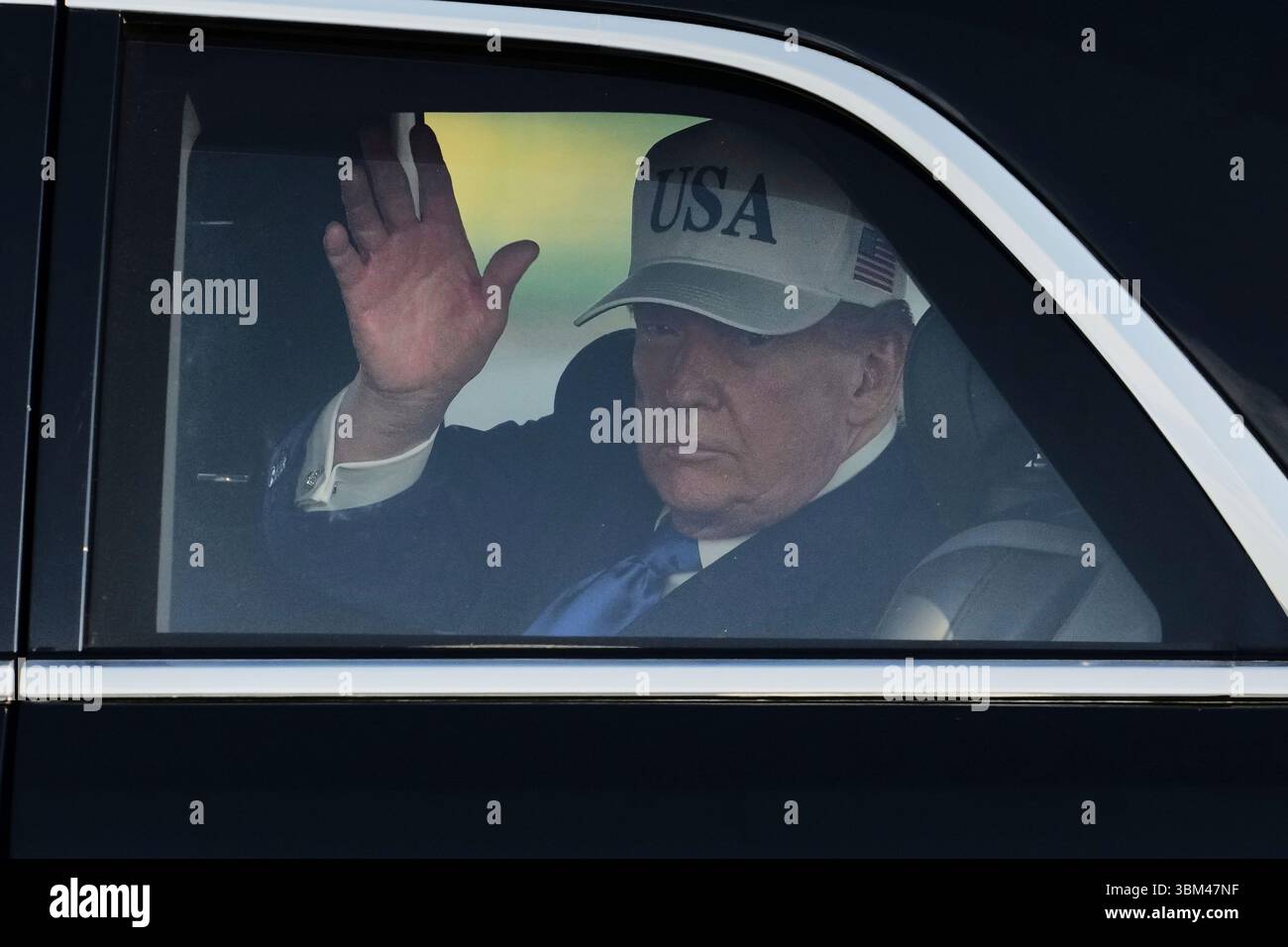 President Donald Trump waves after arriving at Amsterdam Schiphol ...