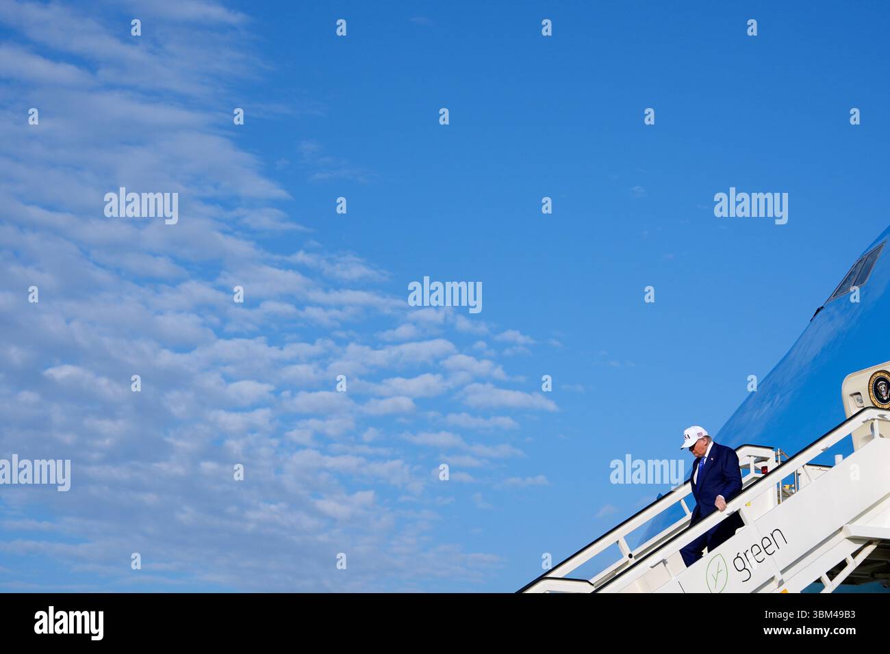 President Donald Trump exits Air Force One as he arrives at Amsterdam ...