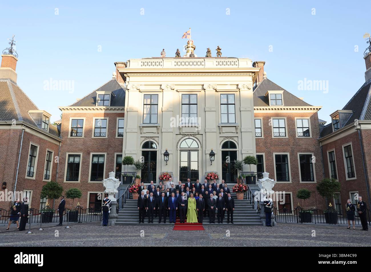NATO heads of state and government pose for a group photo prior to a ...