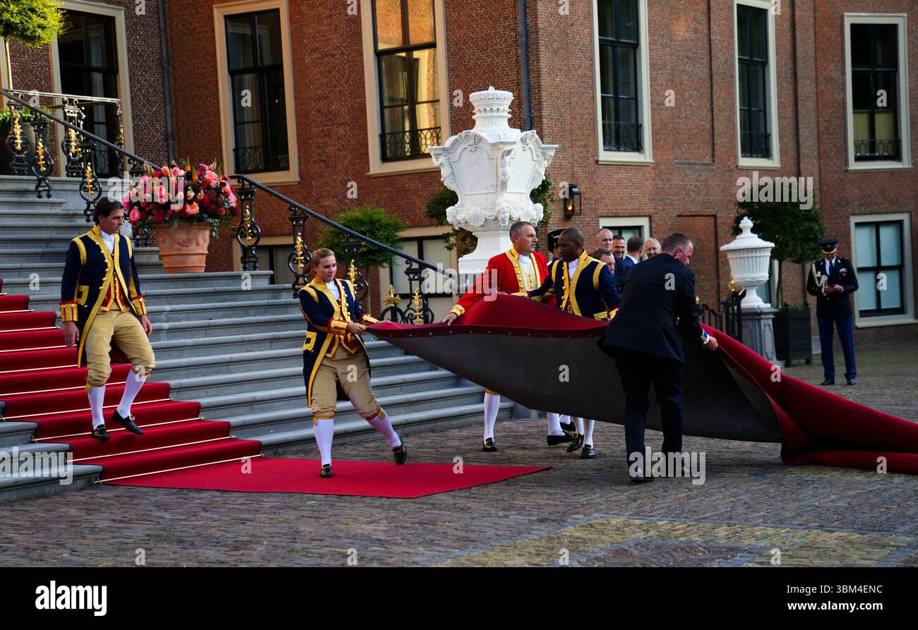 The Hague, Netherlands. 24th June, 2025. Palace staff fix the red ...