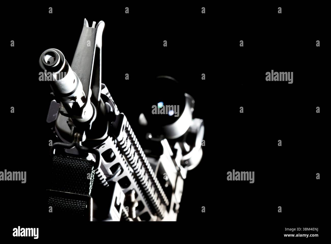 An American AR-15 assault rifle rests in a studio setting against a ...