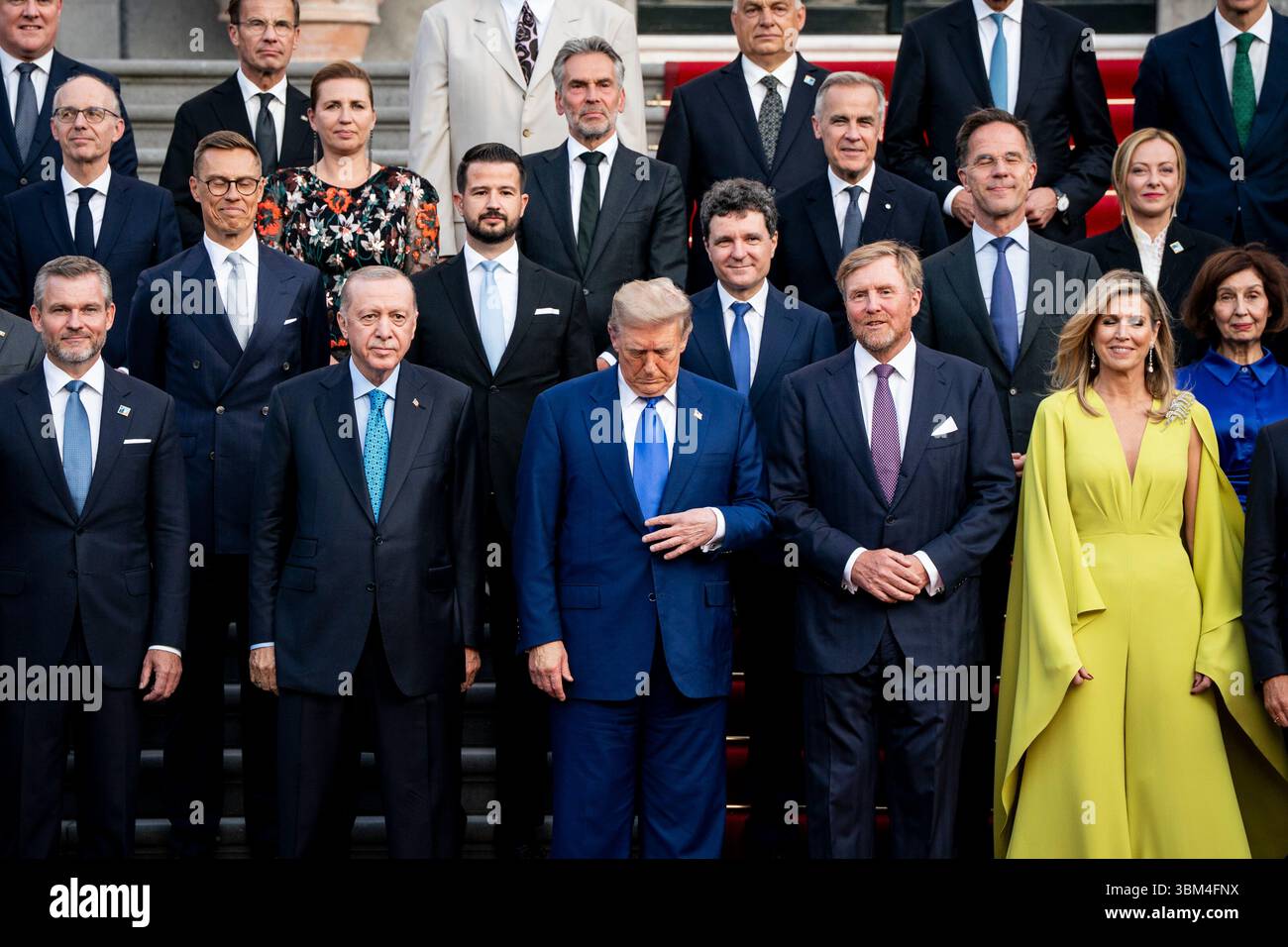 US President Donald Trump, center, along with the King Willem-Alexander ...