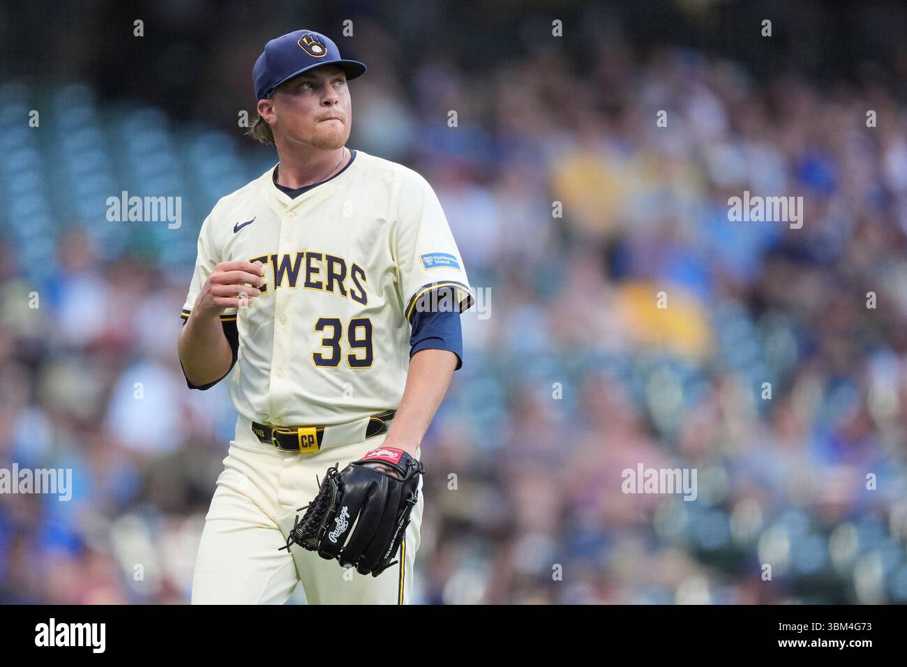 Milwaukee Brewers' Chad Patrick looks on as he walks to the dugout ...