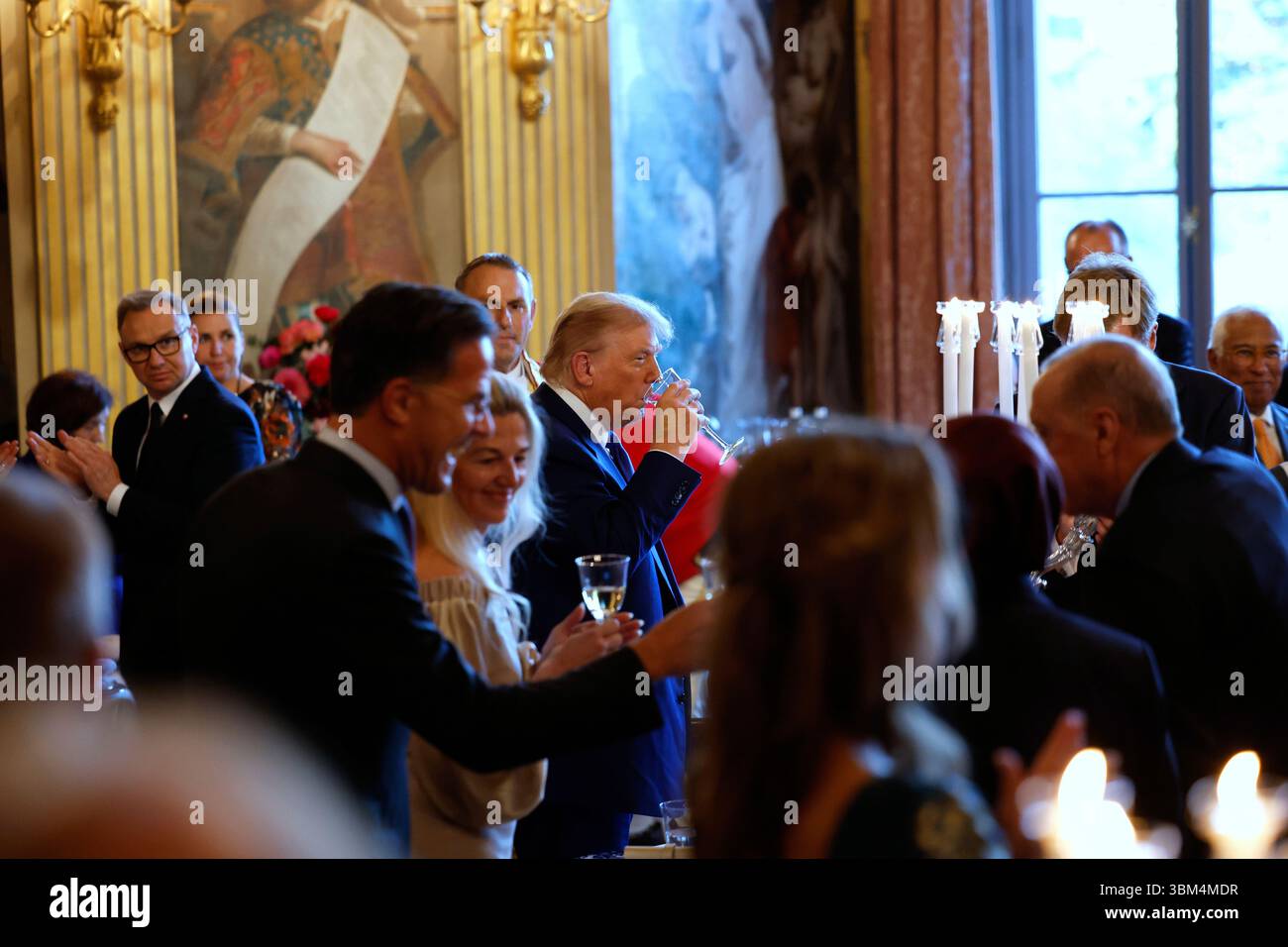 President Donald Trump, center, attends a dinner for NATO heads of ...