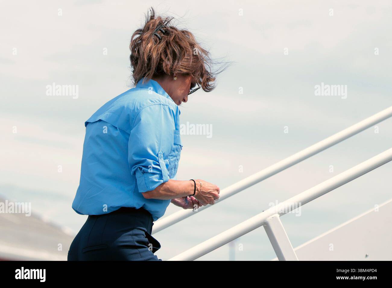 U.S. Homeland Security Secretary Kristi Noem boards a plane as she departs from Panama Pacific ...