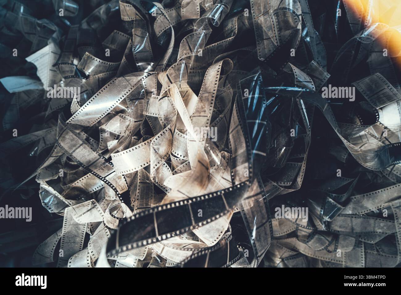 Tangled pile of old damaged 35mm filmstrips, retro photography, analog ...