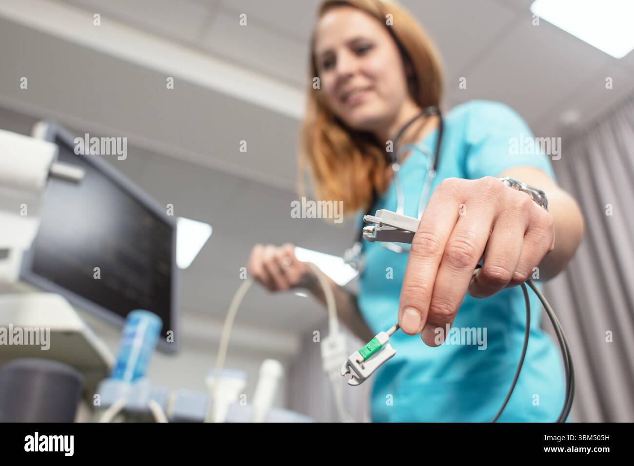 A cardiologist is doing a procedure to check the heart. Cardiologist ...