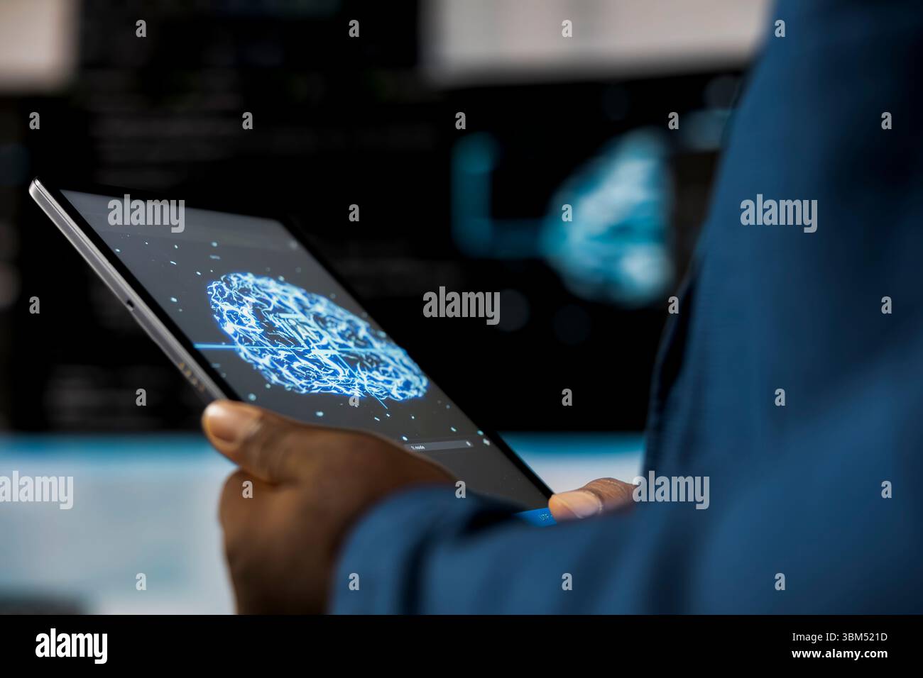 Young professional engineer focused on coding with tablet at an ...