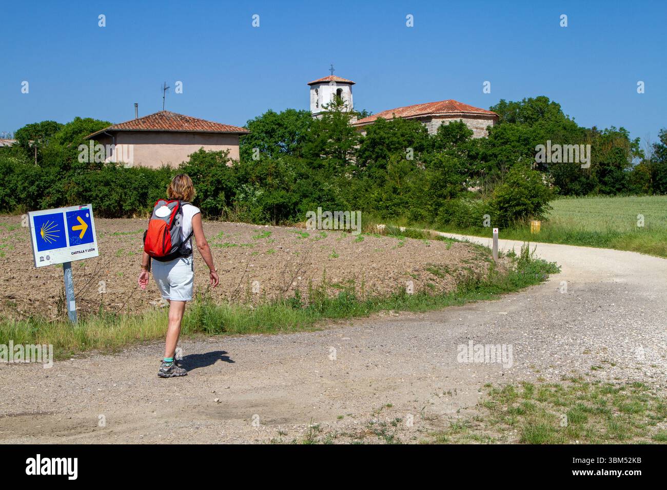 Woman pilgrim walking the Camino de Santiago the way of Saint James ...