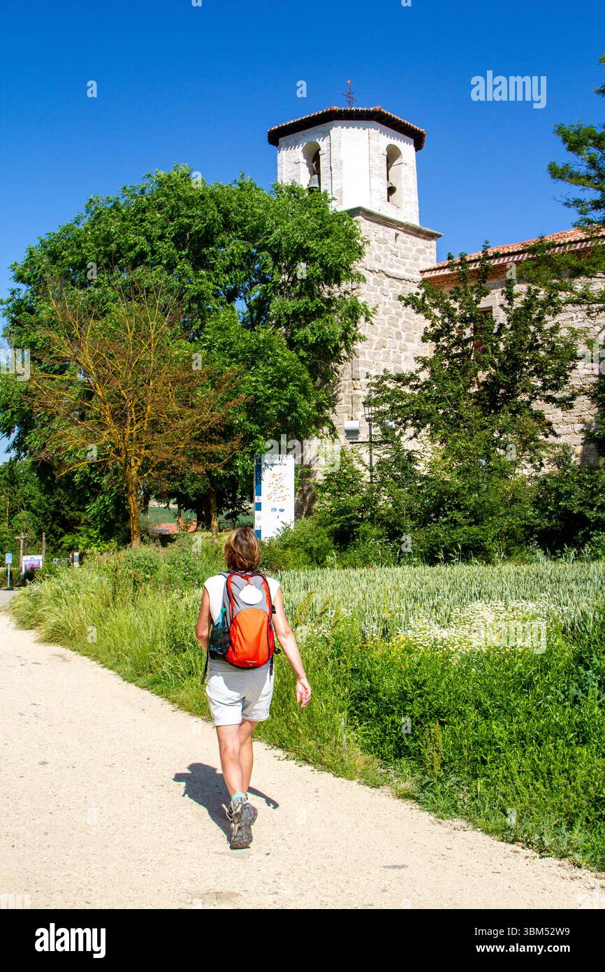 Woman pilgrim walking the Camino de Santiago the way of Saint James ...