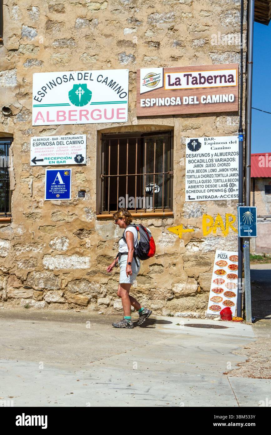 Woman pilgrim walking the Camino de Santiago the way of Saint James ...