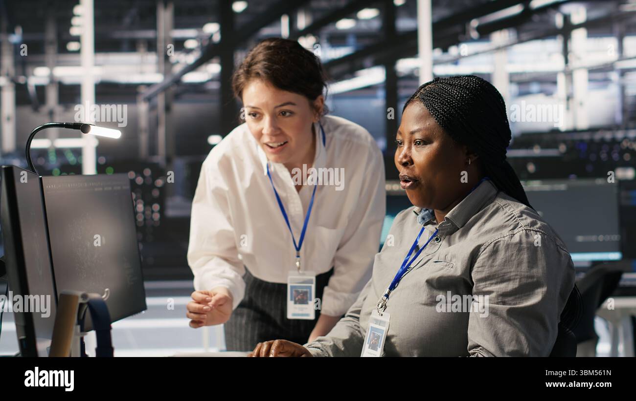 Cheerful data center admin pleased hi-res stock photography and images - Alamy