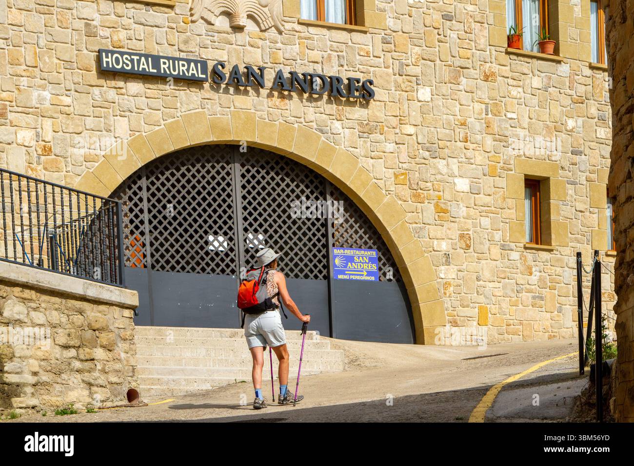Pilgrim woman walking the Camino de Santiago the way of St James ...