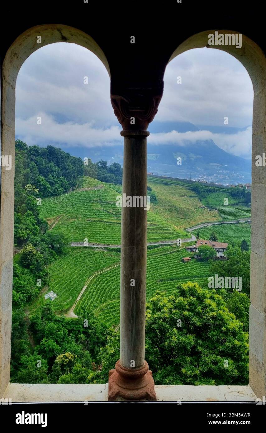 View from double arched window of ancient Tyrol castle to green ...