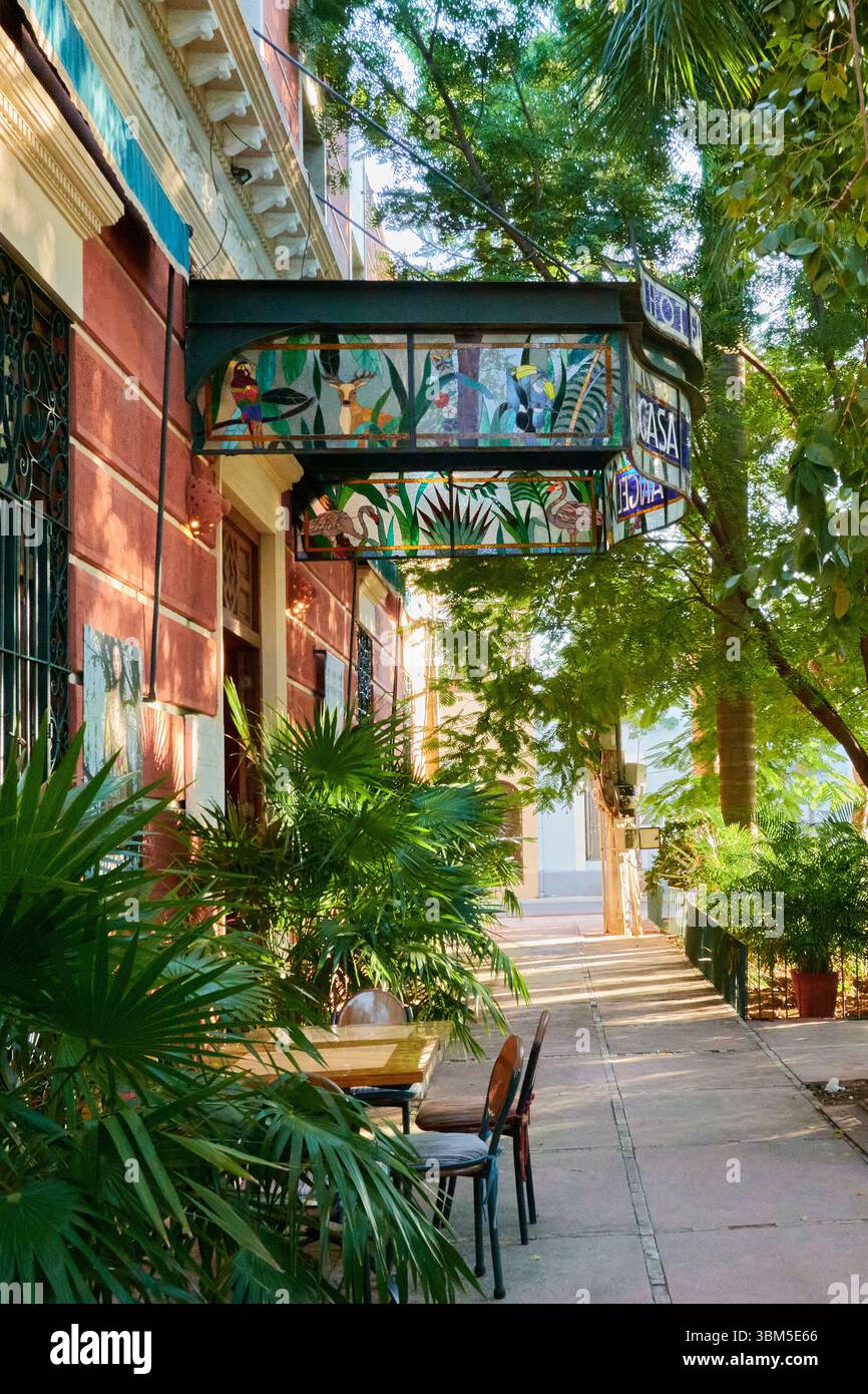 Mexico, Merida. Exterior of Hotel Angel with colorful hand-painted sign ...