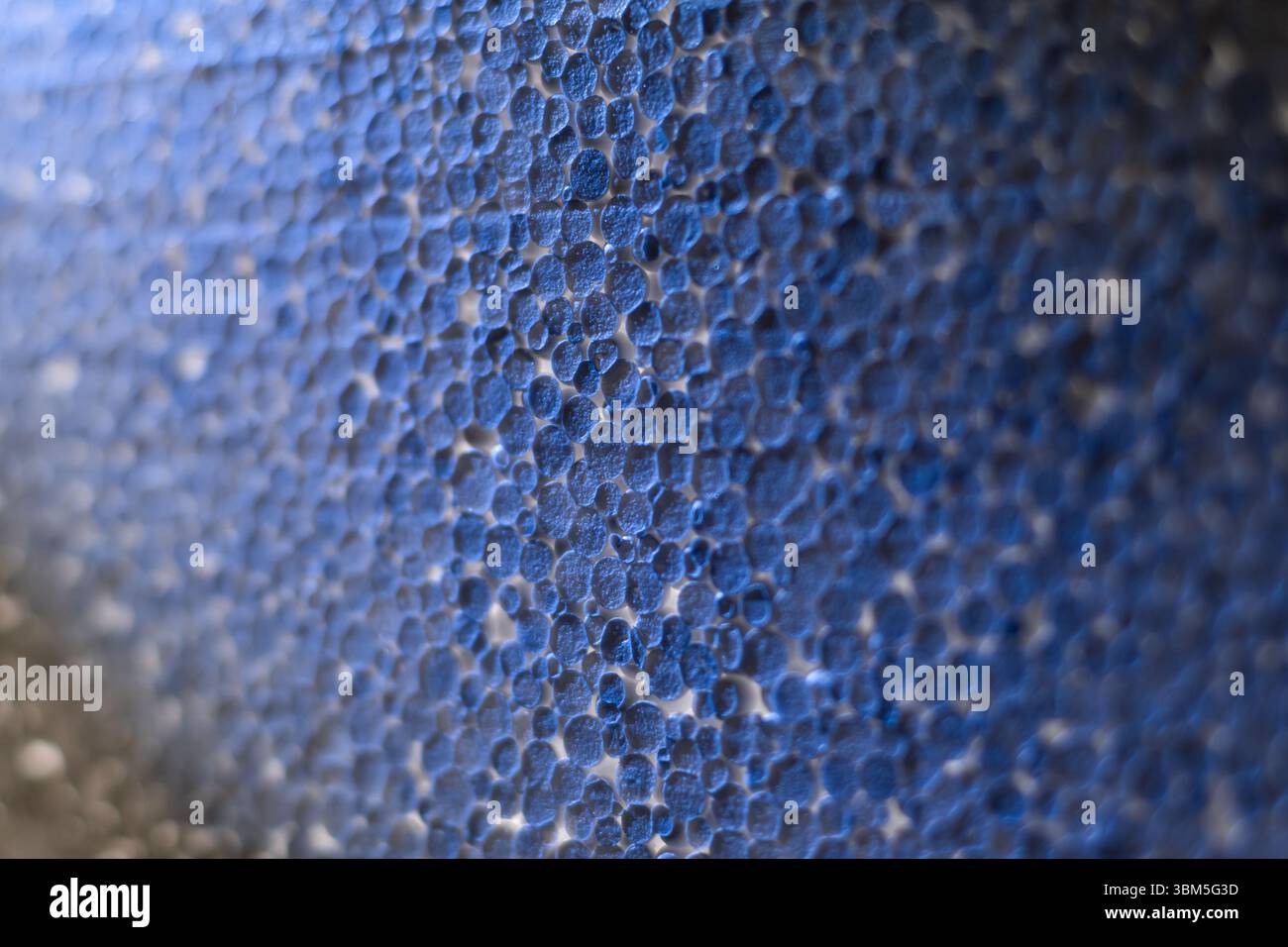 Styrofoam plate, close-up of granules, macro, illuminated by cold light ...
