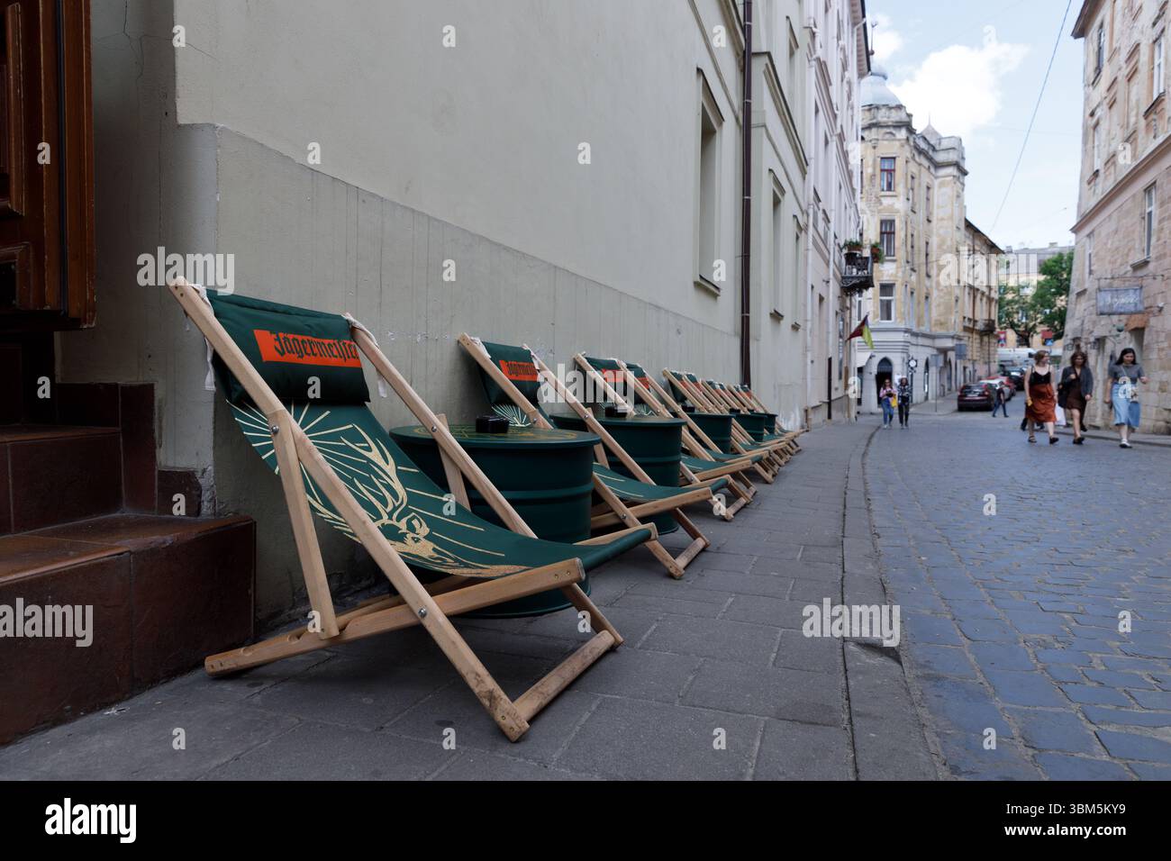 The image showcases inviting outdoor lounge chairs adorned with J ...