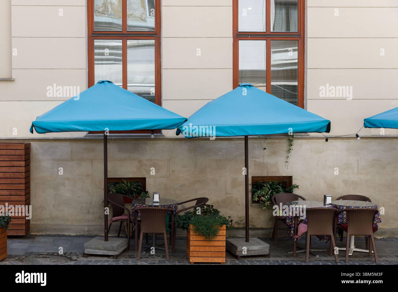 Charming outdoor cafe setting features hi-res stock photography and ...